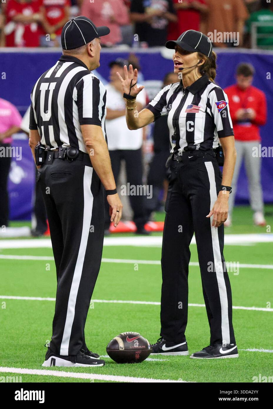 HOUSTON, TX - DECEMBER 27: (left to right) Umpire Robert Colosimo chats ...