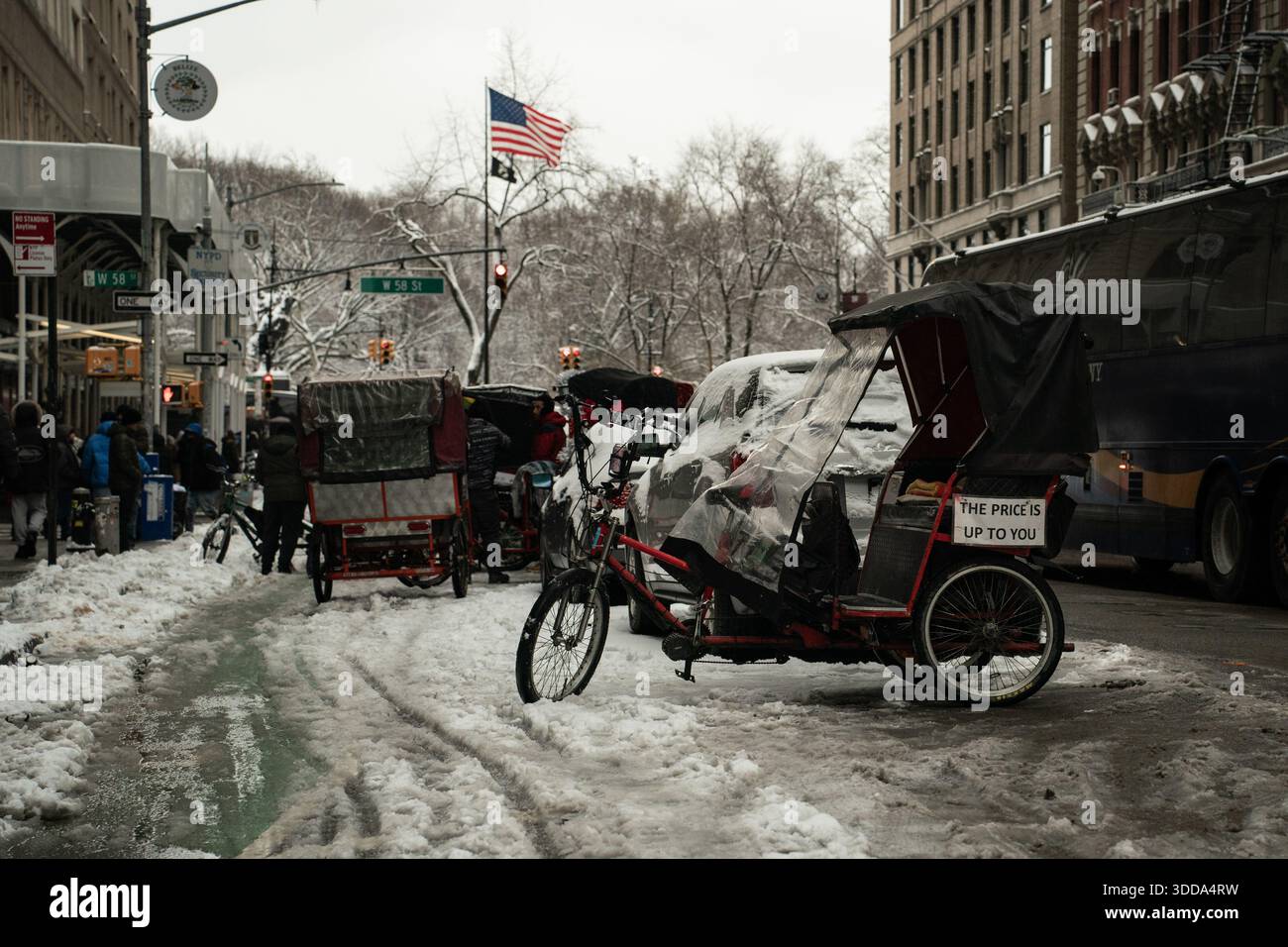 An empty pedal taxi sits on the side of the road near Central Park ...