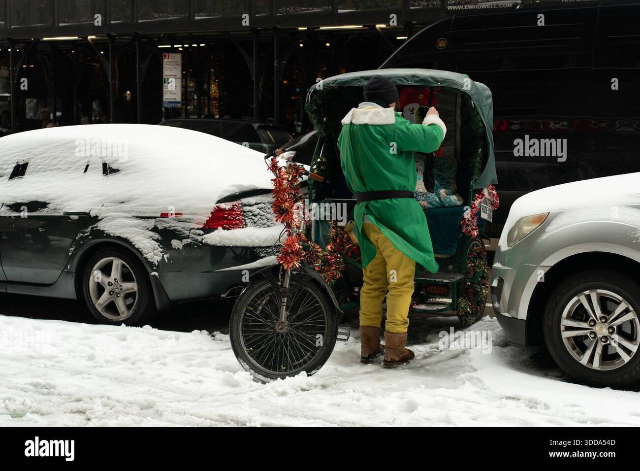 A man, dressed as Buddy from the movie 'Elf', prepares his pedal taxi ...