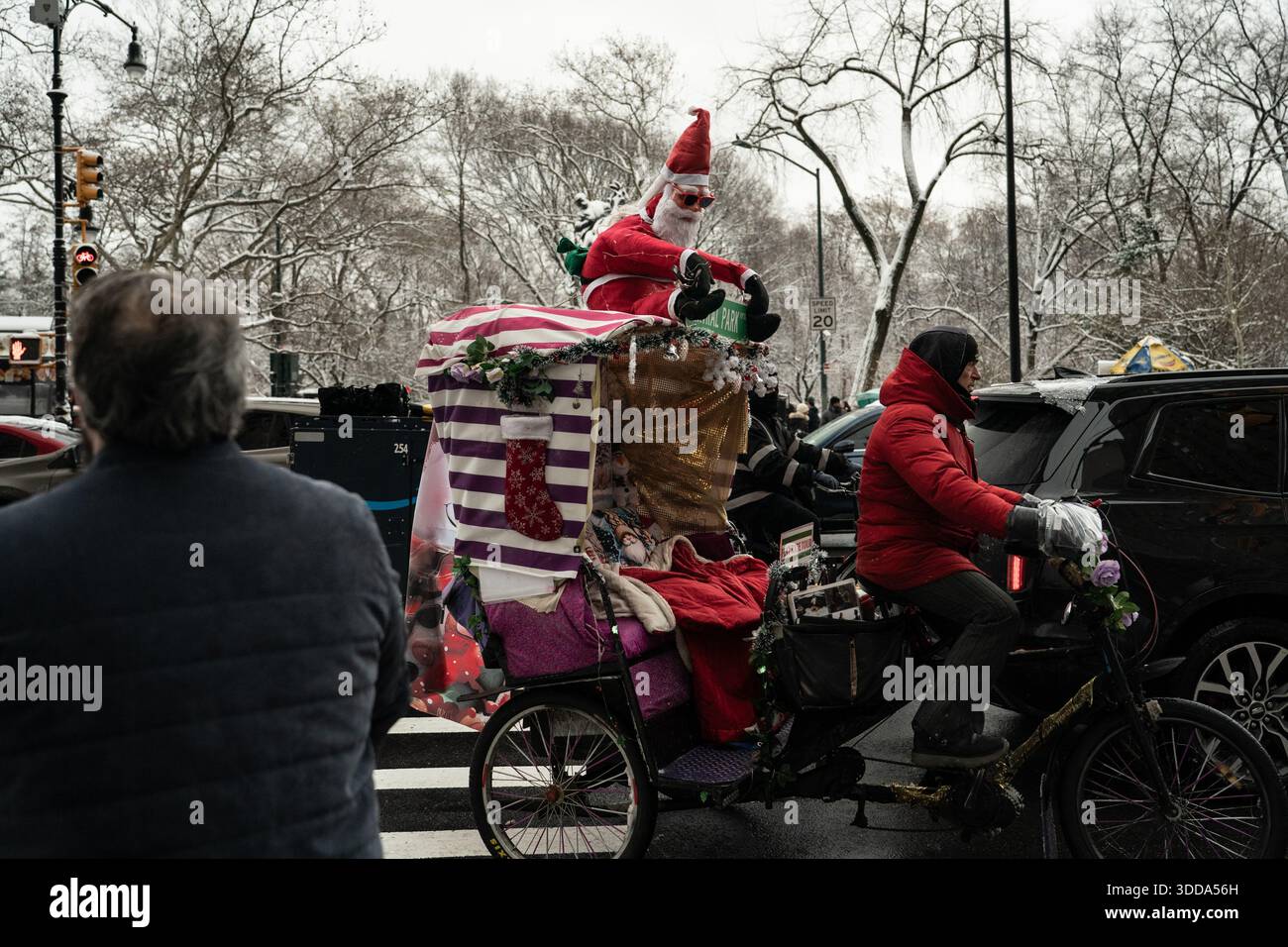 A Christmas-themed pedal taxi passes Central Park after an overnight ...