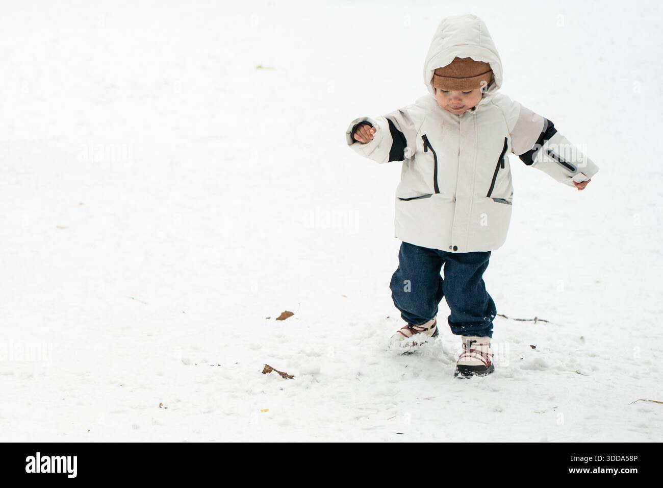 A boy enjoys the snow after an overnight snowstorm on December 27, 2025 ...