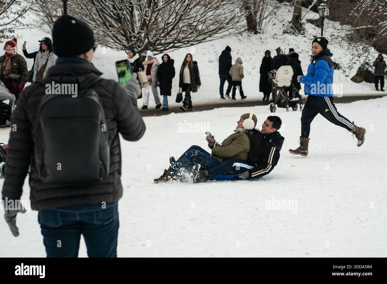 People sledding in Central Park after an overnight snowstorm on ...