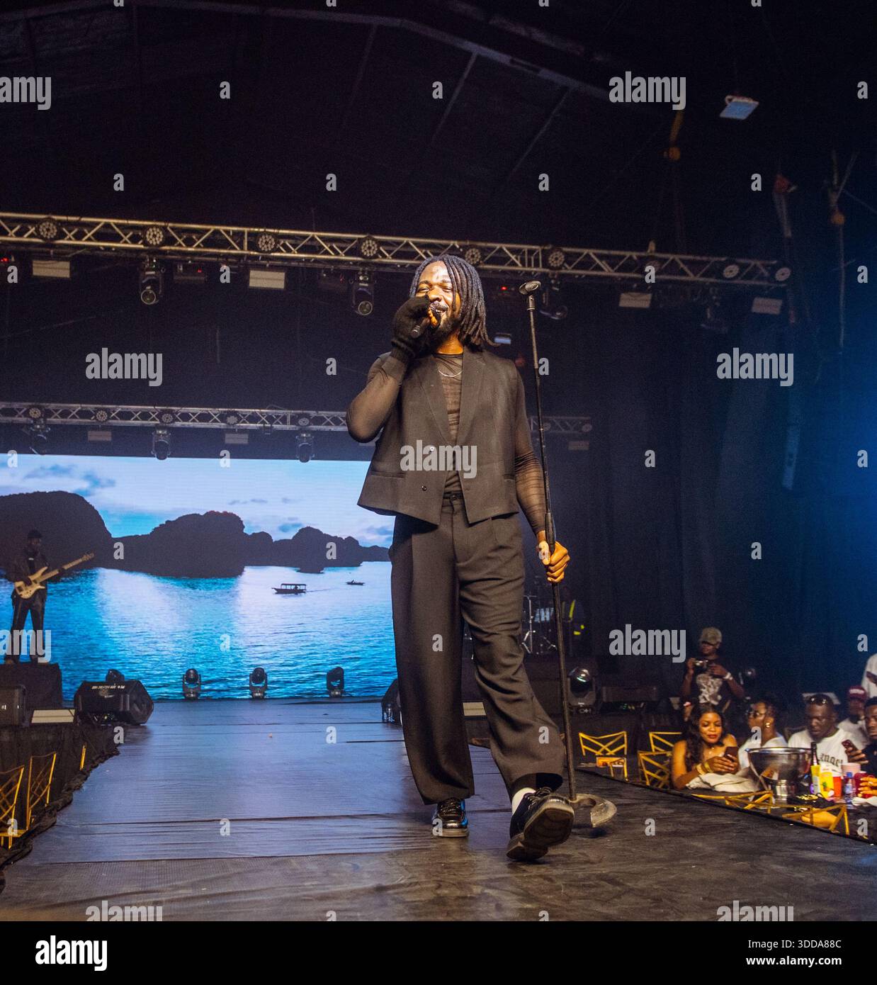 Nigerian singer Johnny Drille performs during a live concert in Benin ...