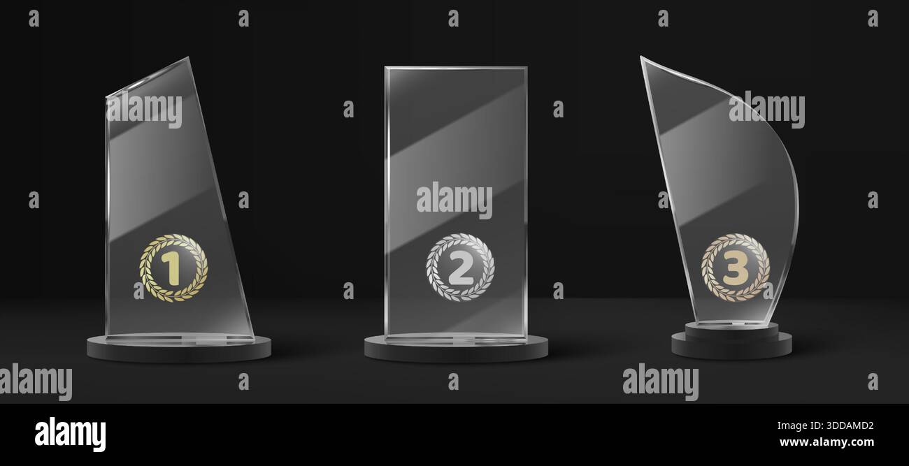 Glass trophy set with golden, silver and bronze laurel wreaths on dark ...