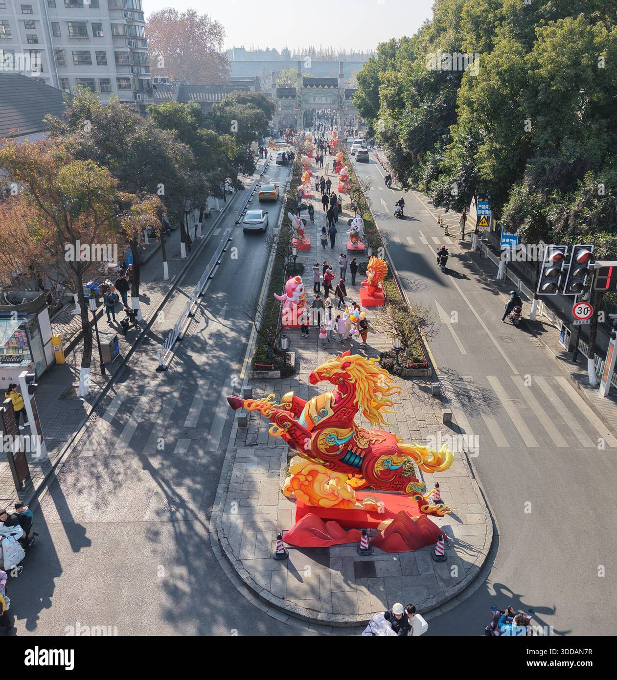 Workers install festive lanterns at Laomendong historical block in ...