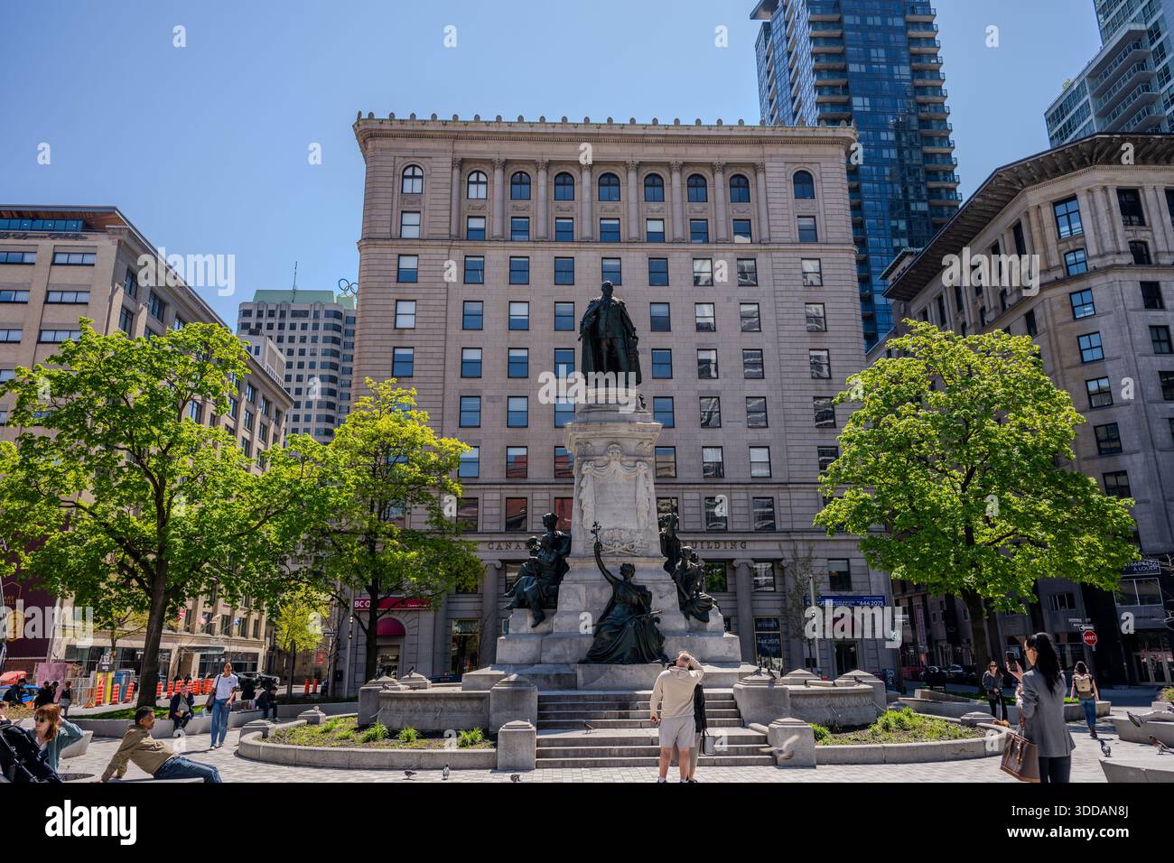 Statue of Sir Wilfrid Laurier rises above allegorical bronze figures in ...