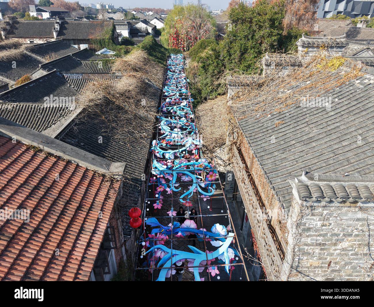 Workers install festive lanterns at Laomendong historical block in ...
