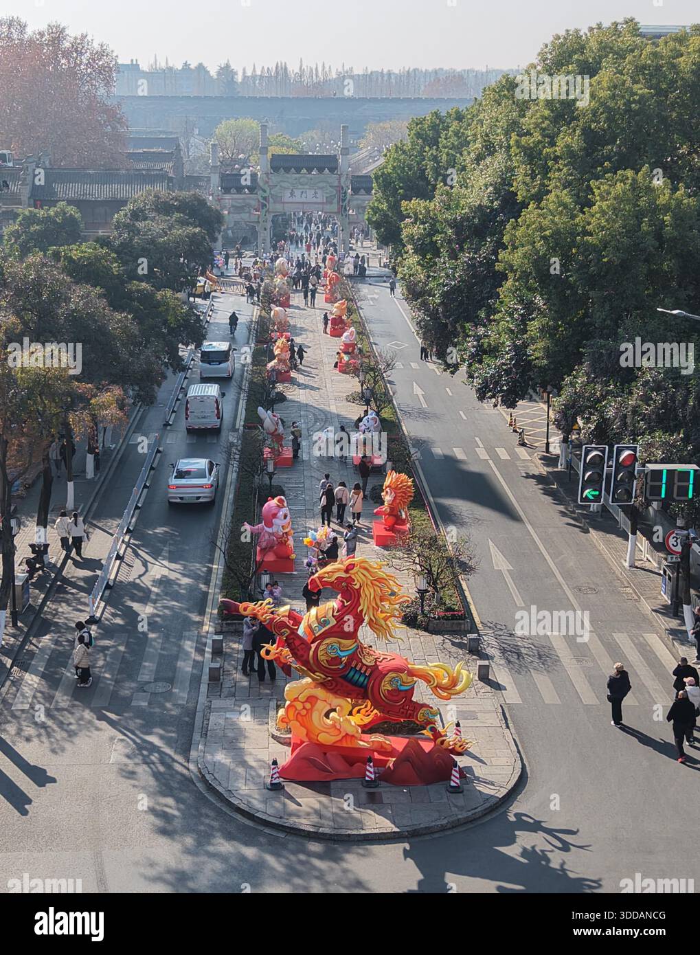 Workers install festive lanterns at Laomendong historical block in ...