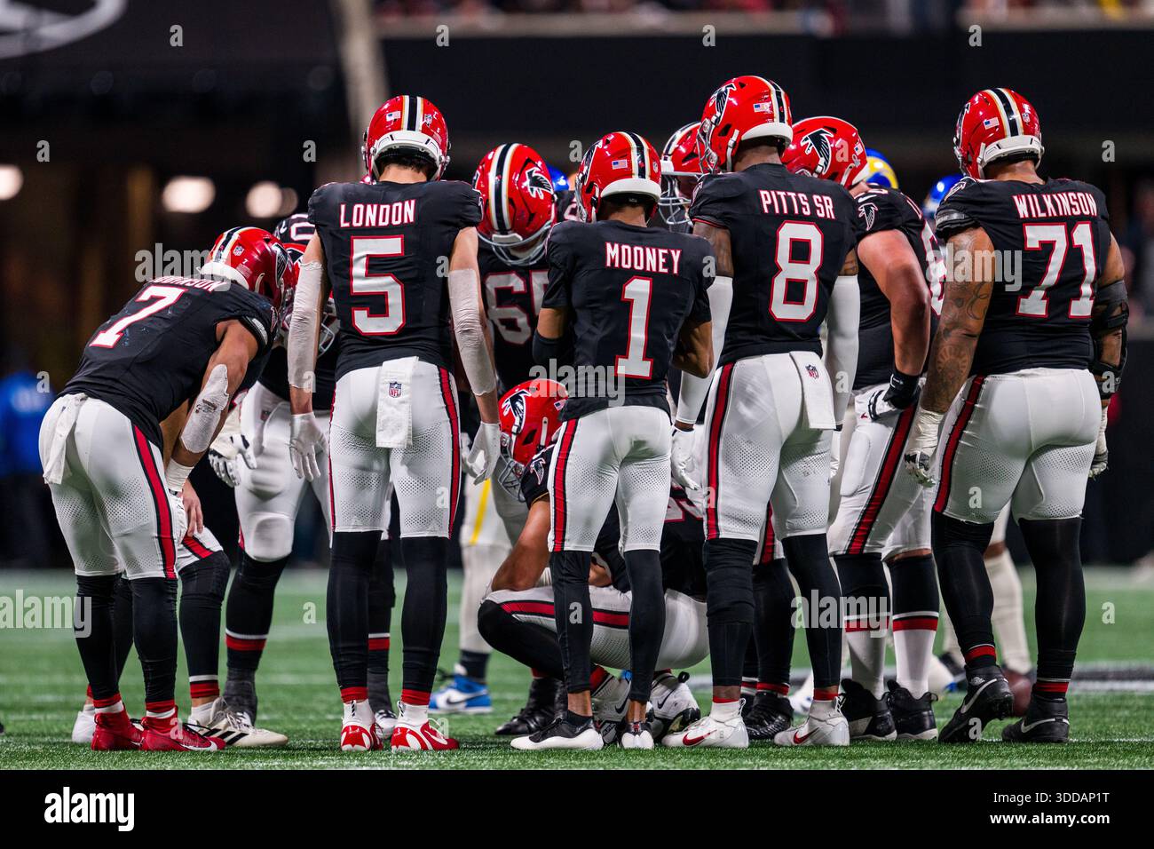 The Atlanta Falcons offense huddles during the second half of an NFL ...