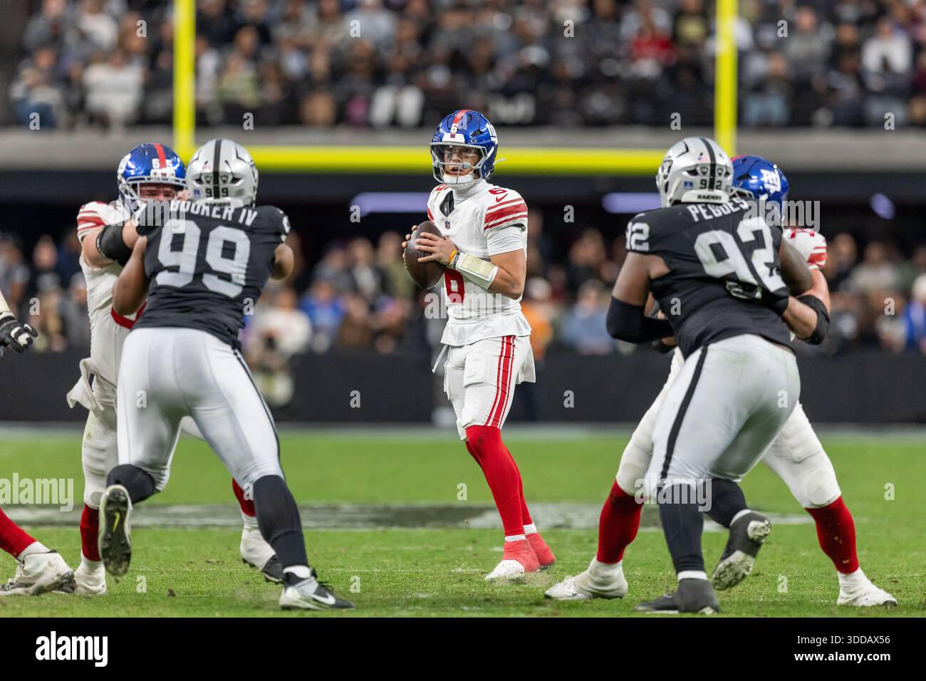New York Giants quarterback Jaxson Dart (6) drops back to pass against ...