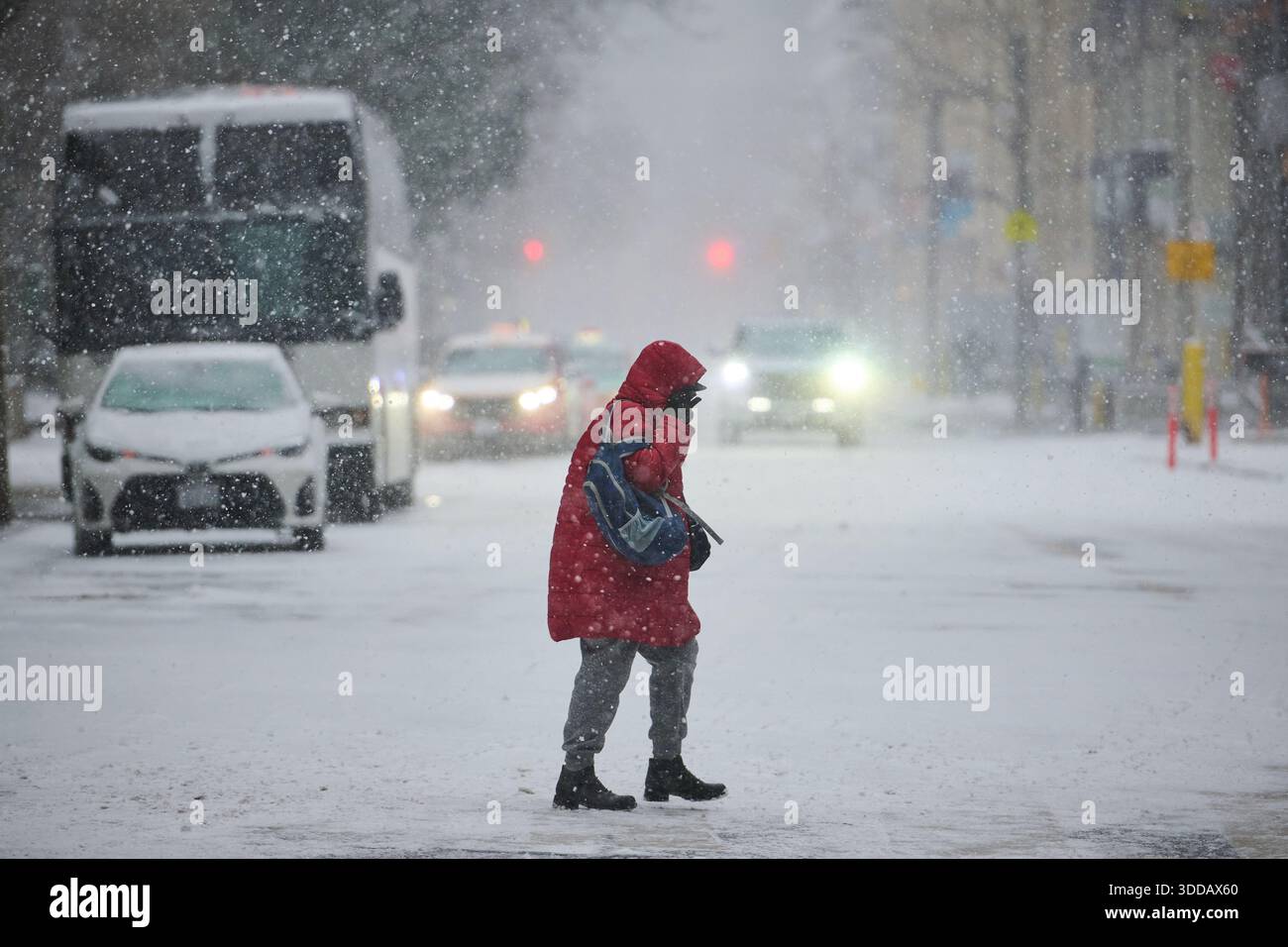 Pedestrians walk through a snow storm on Boxing Day in Toronto, on ...