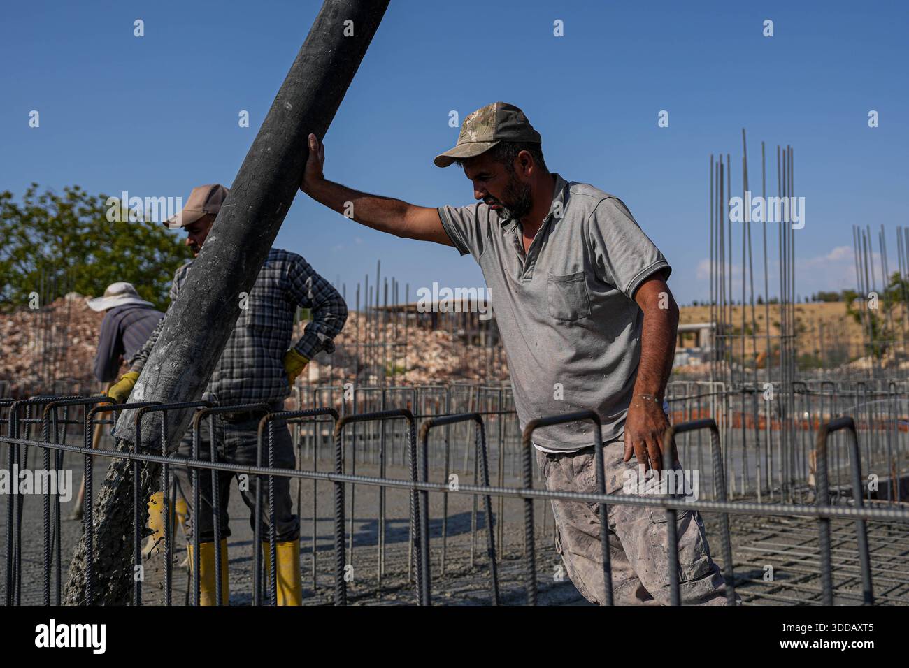 Construction workers are preparing steel reinforcement, erecting steel ...