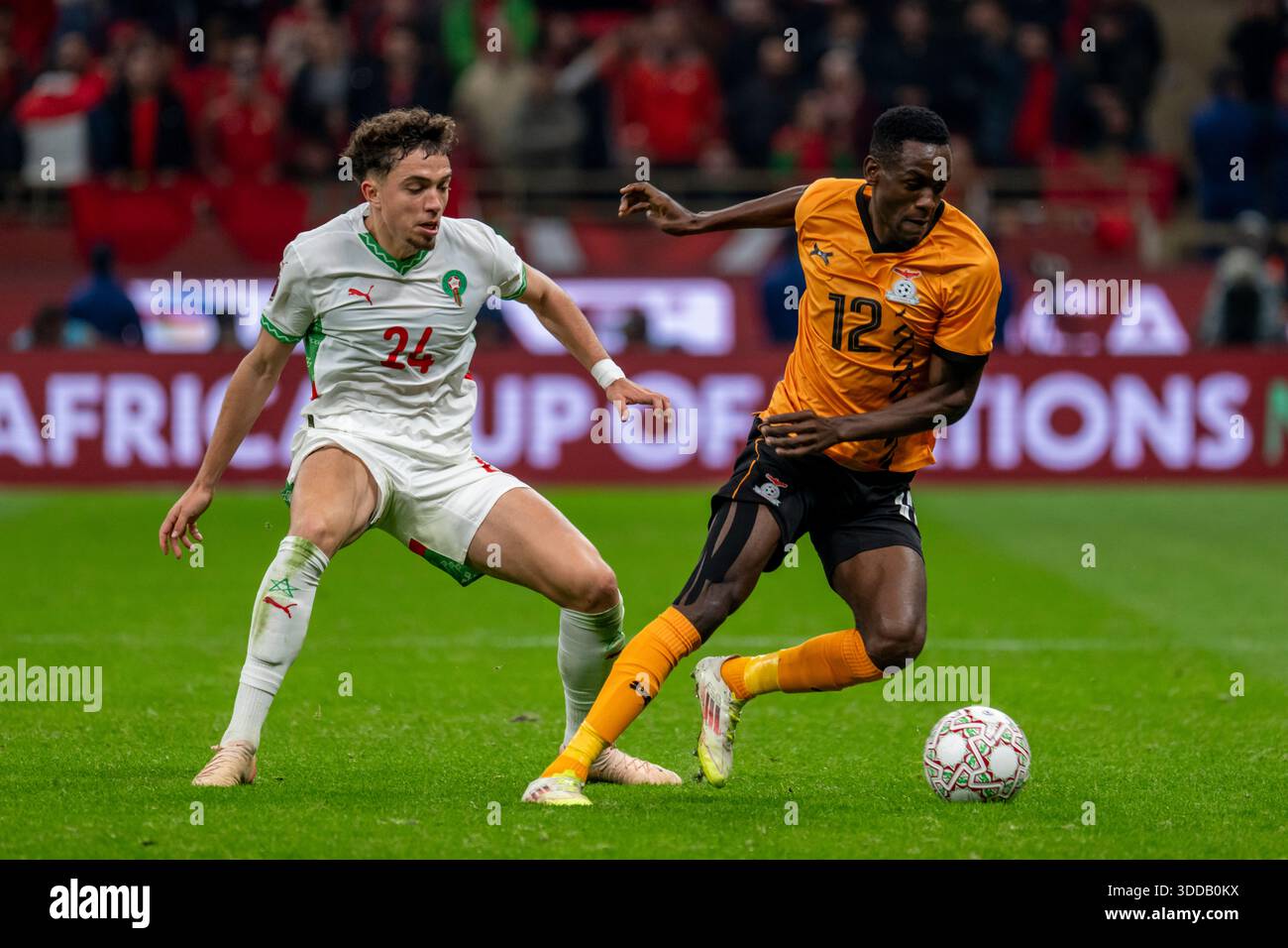 Wilson Chisala of Zambia duels with Neil El Aynaoui of Morocco during ...