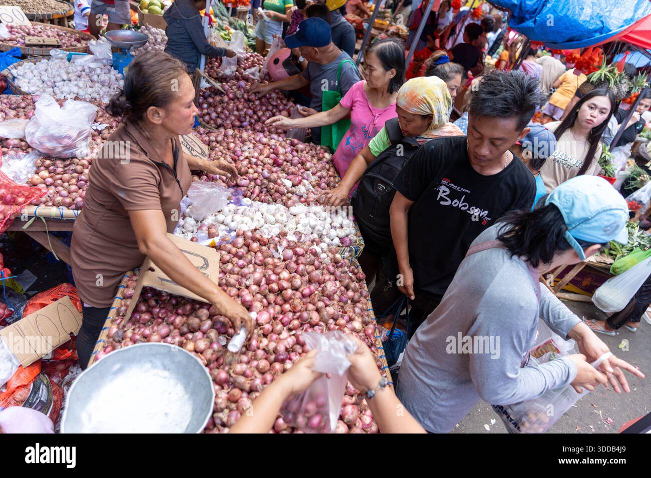 Crowded onion stall at a busy public market in the Philippines Stock ...