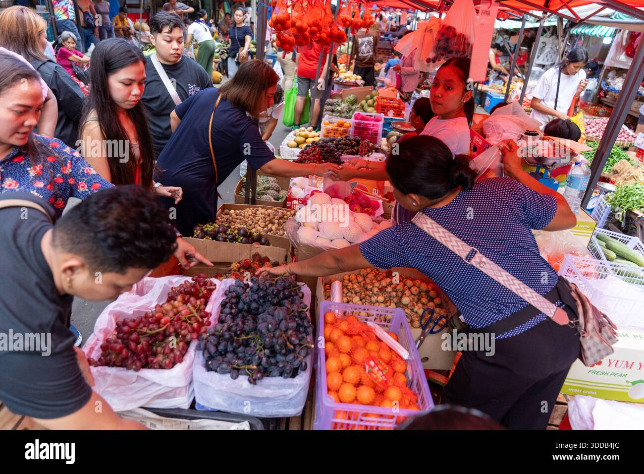 Crowded fruit stall at a busy public market in the Philippines Stock ...