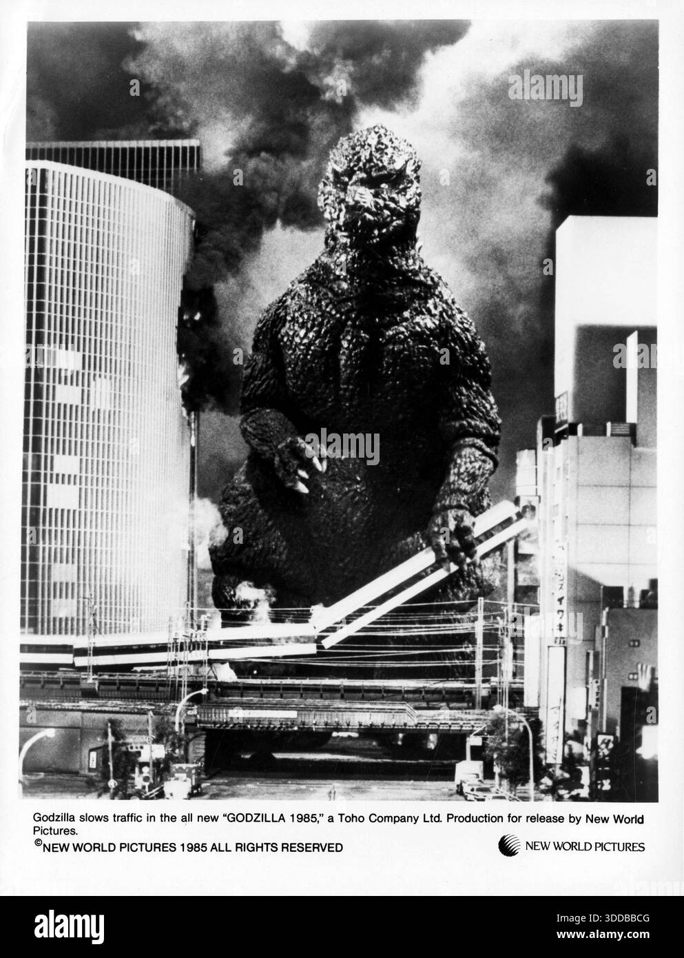 Godzilla slows traffic in the all new "Godzilla 1985" card Stock Photo ...