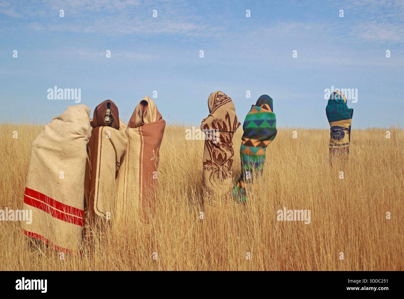 FILE - Xhosa boys stand in a field during traditional Xhosa male ...