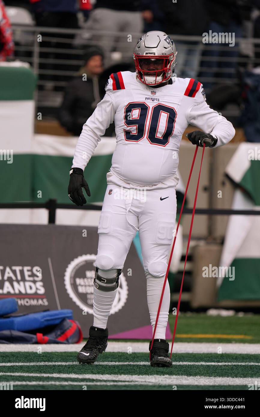 New England Patriots defensive tackle Christian Barmore (90) warms up ...