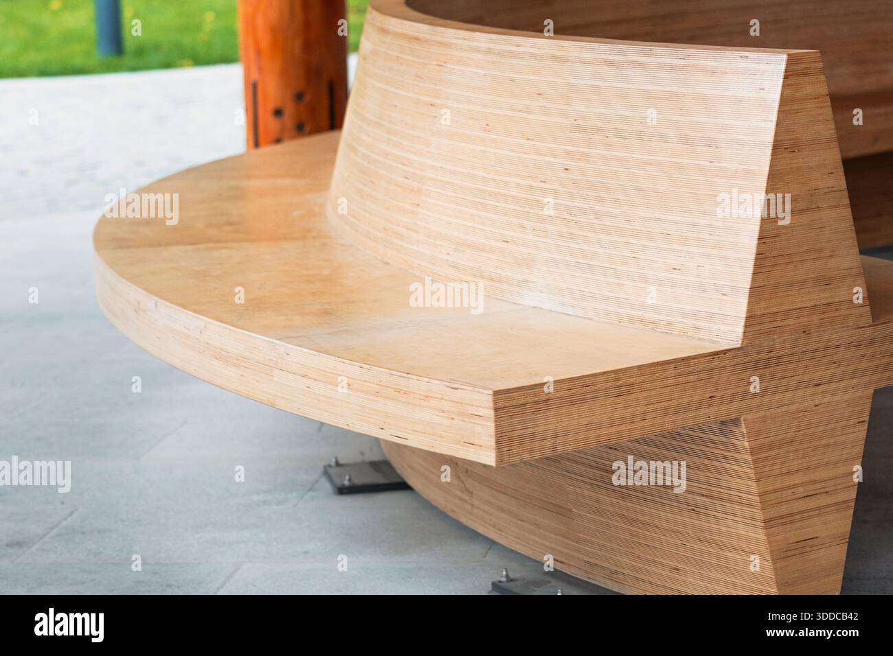 Modern plywood bench featuring curved lines and layered wood ...