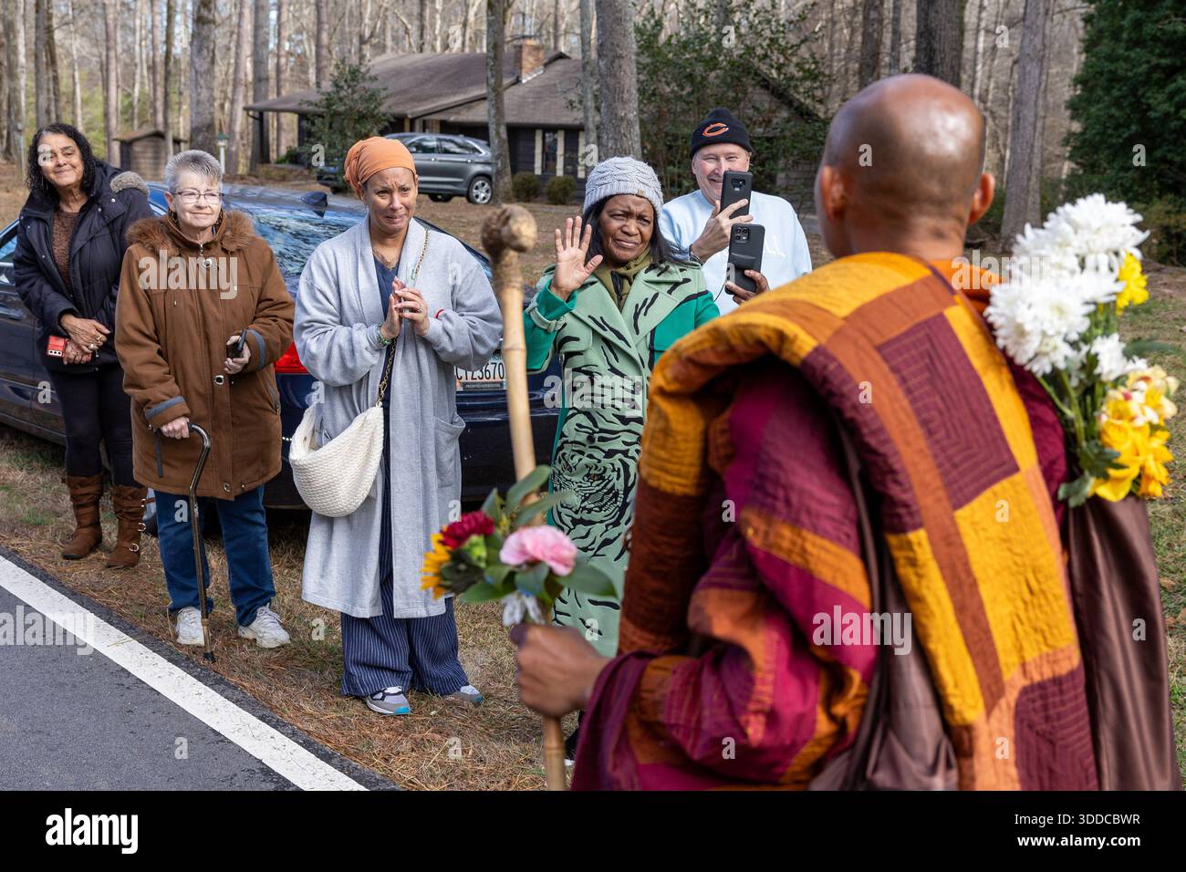 Supporters greet Buddhist monks on a "Walk for Peace" on Veterans ...