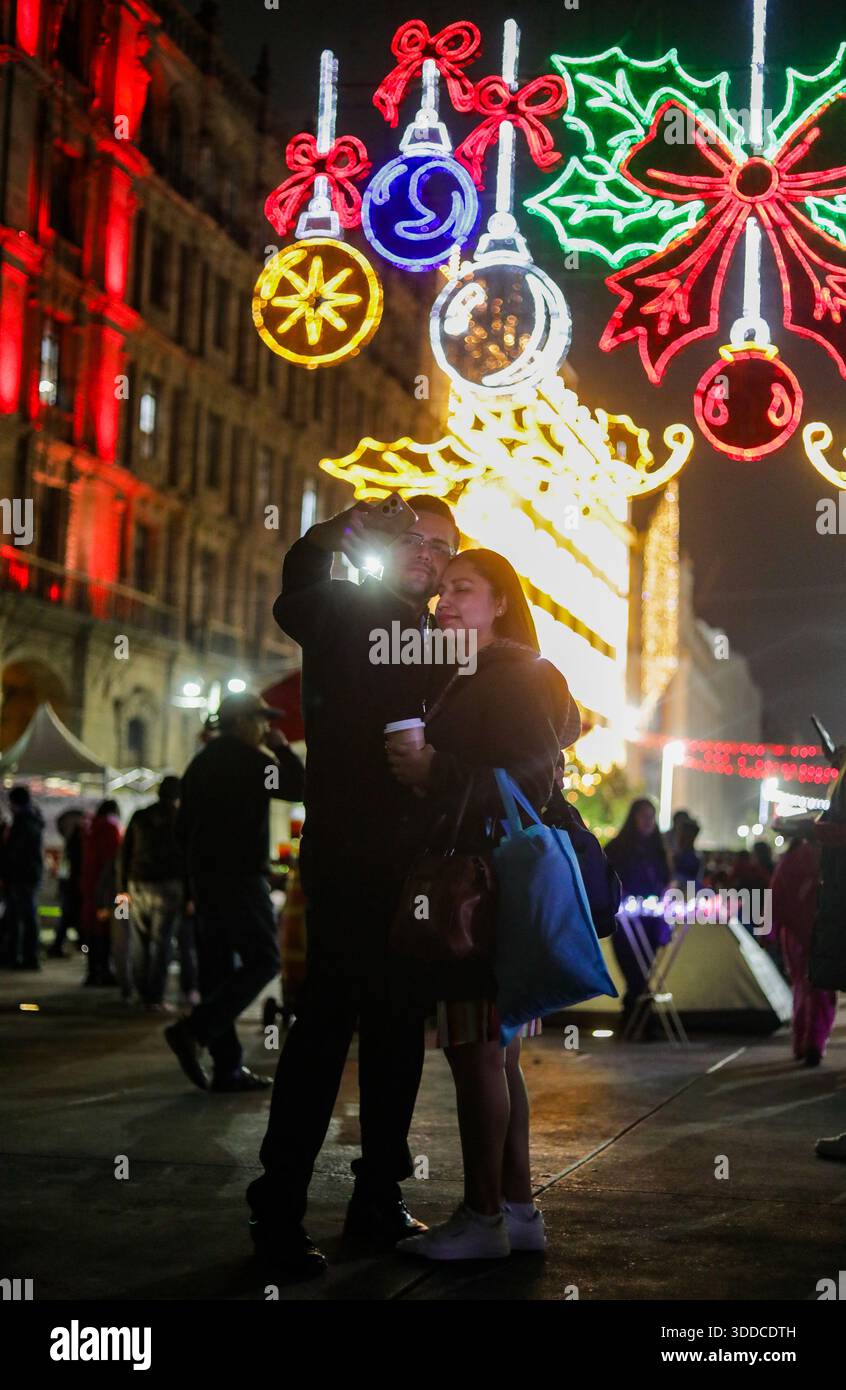 People attend at Main square Zocalo to enjoy the Christmas lights ...