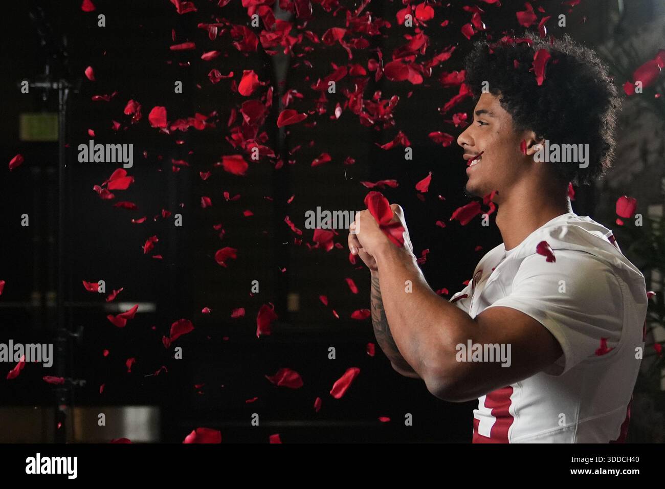 Alabama defensive back Ivan Taylor throws rose pedals in the air during ...