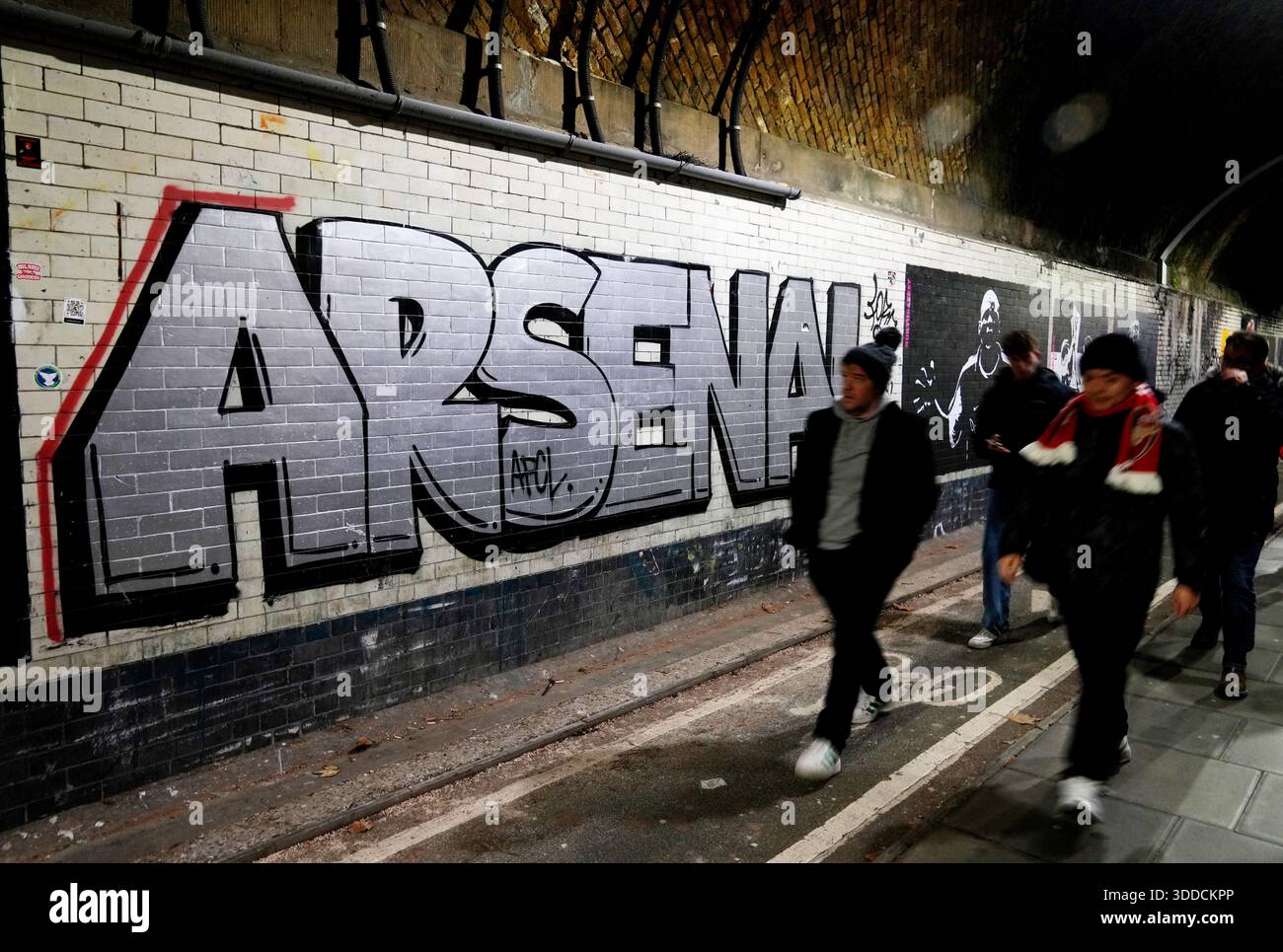 Arsenal fans make their way to the Emirates Stadium, London ahead of ...