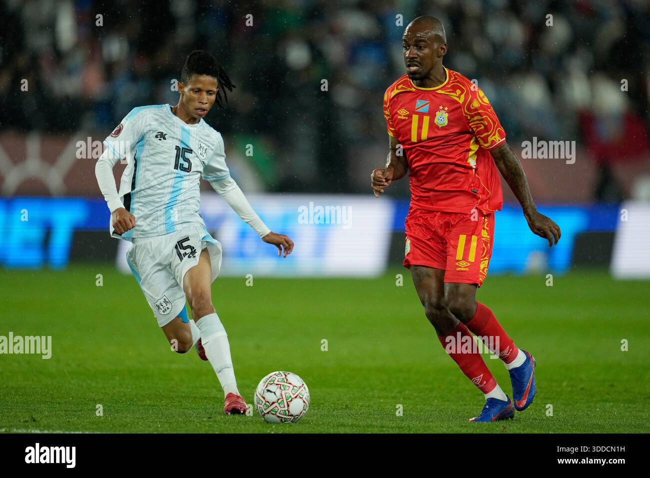 DR Congo's Gael Kakuta, right, and Botswana's Mothusi Cooper challenge ...