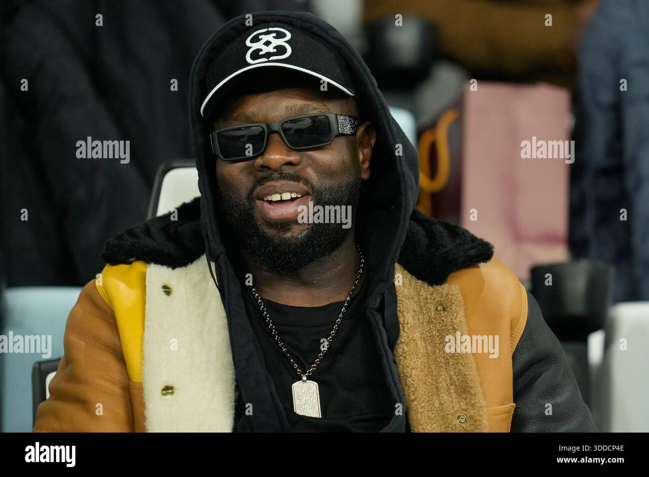 Congolese singer and rapper Gims looks out from the stands during the ...