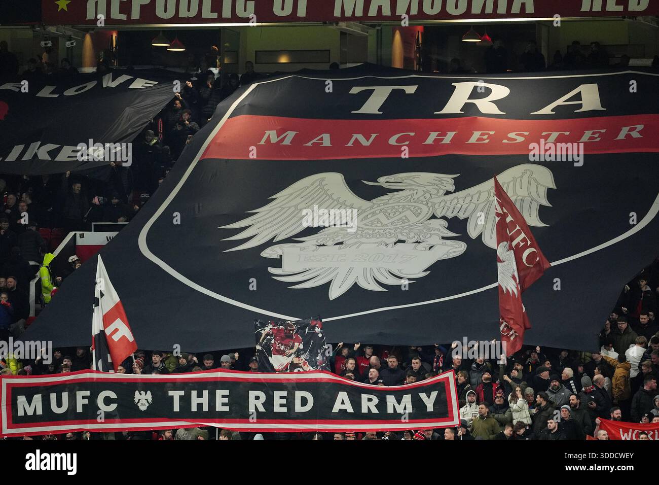 Manchester United fans unveil banners ahead of the Premier League match ...