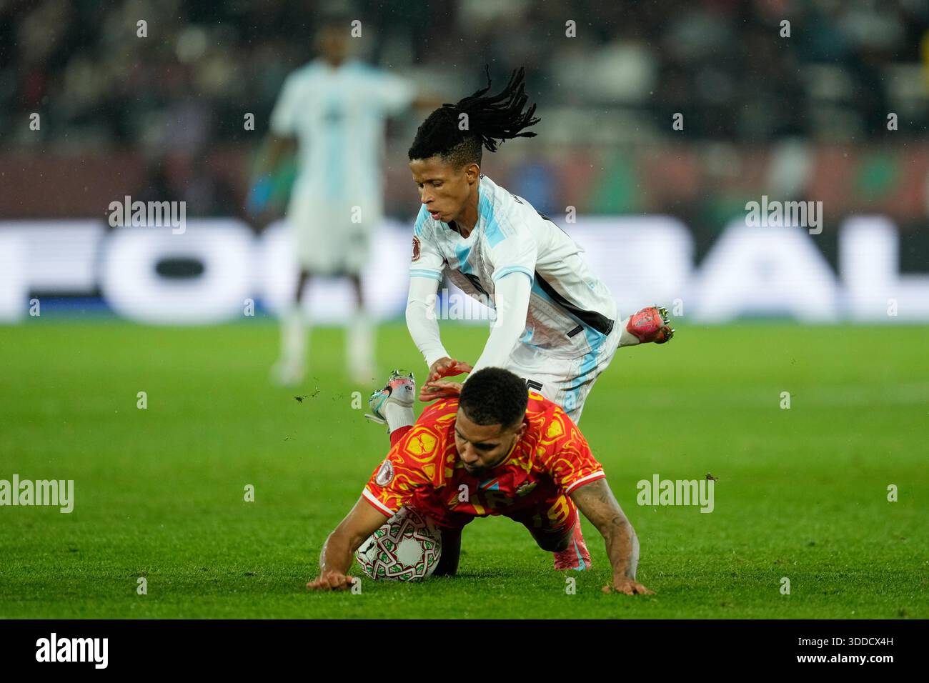 Botswana's Mothusi Cooper, top, and DR Congo's Charles Pickel challenge ...
