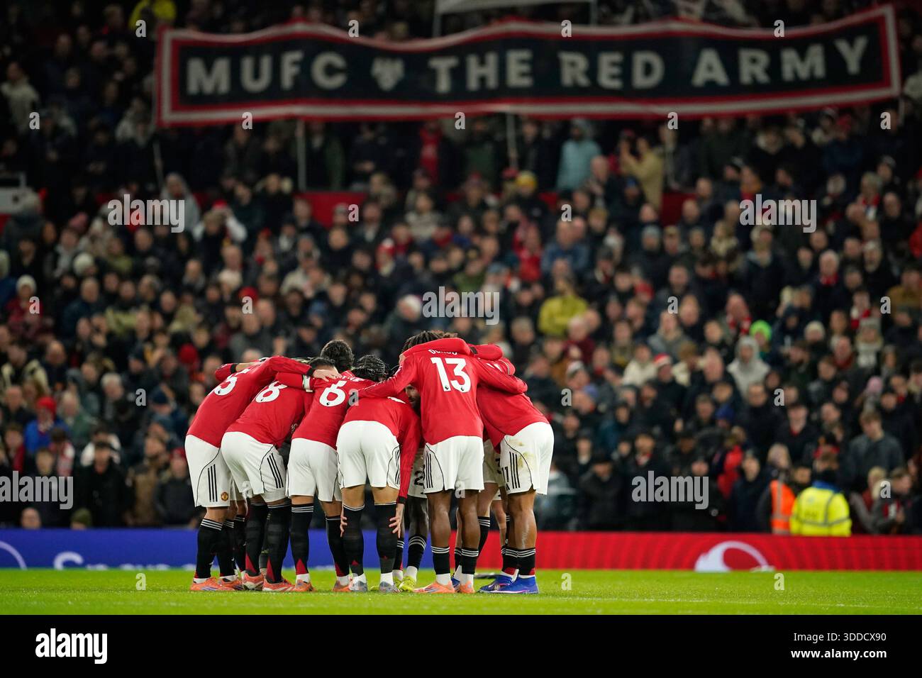 Manchester's players stand together at the start of the English Premier ...