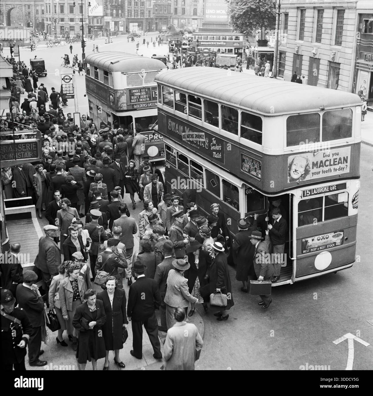 Crowds including servicemen queue for buses in the strand hi-res stock photography and images ...