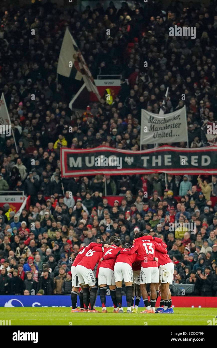 Manchester's players stand together at the start of the English Premier ...