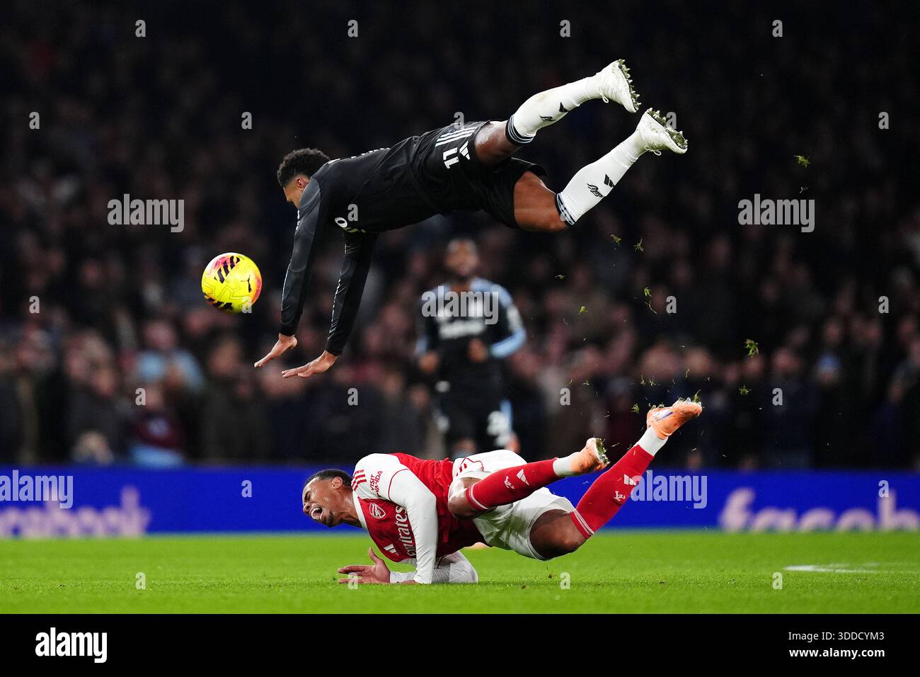 Arsenal's Gabriel is fouled by Aston Villa's Ollie Watkins (top) during ...