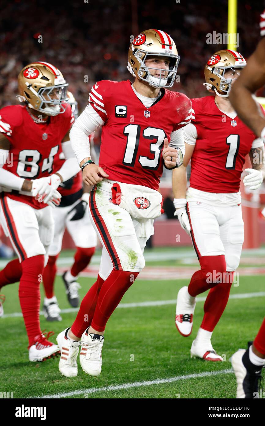 San Francisco 49ers quarterback Brock Purdy (13) reacts after scoring a ...