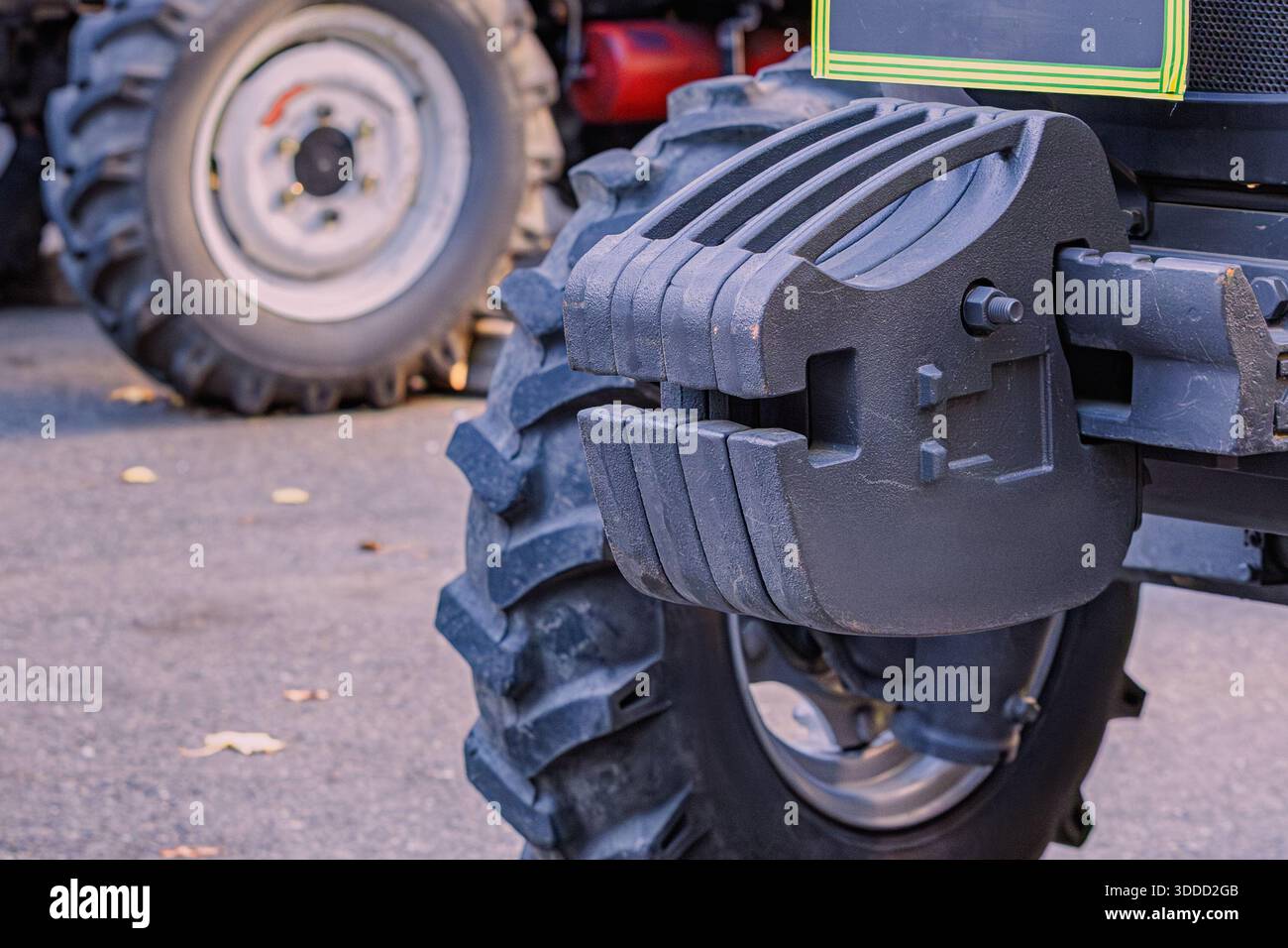 Tractor front end showing heavy counterweights and deep tread ...