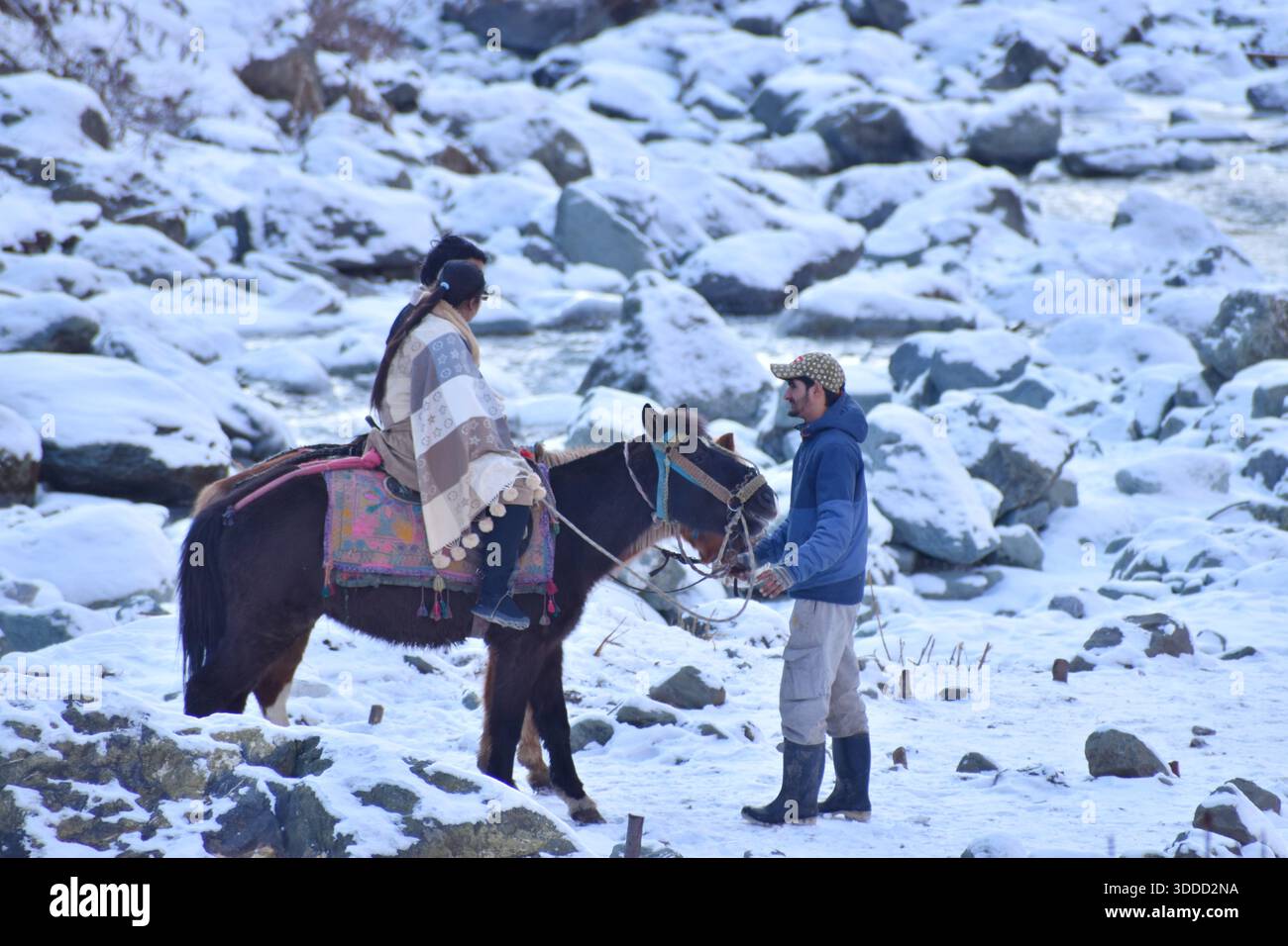 Tourists enjoy a walk at snow mountain after a heavy snowfall at ...