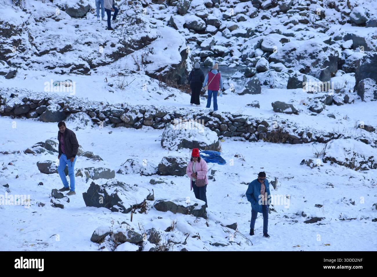 Tourists enjoy a walk at snow mountain after a heavy snowfall at ...