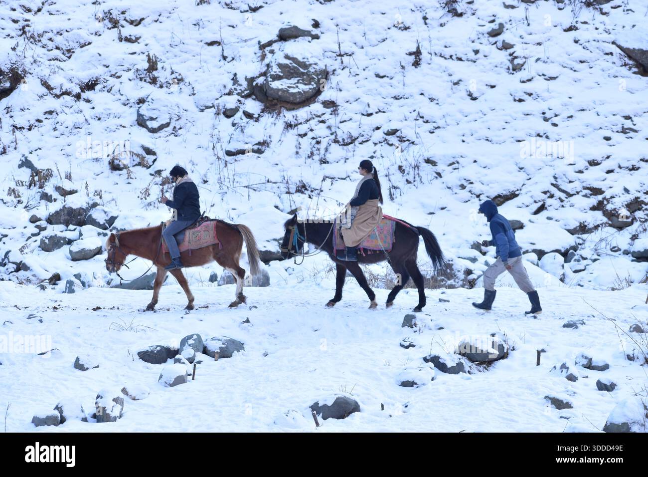 Tourists enjoy a walk at snow mountain after a heavy snowfall at ...