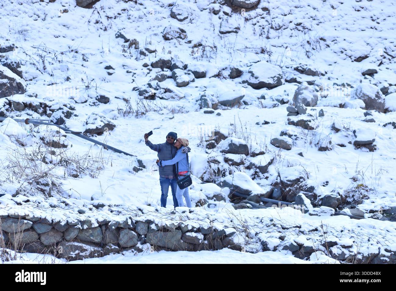 Tourists enjoy a walk at snow mountain after a heavy snowfall at ...