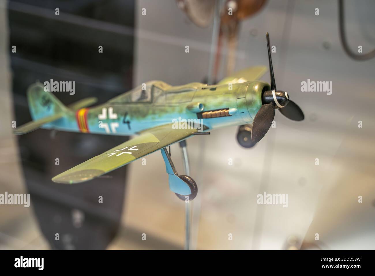 A detailed scale model of a German WWII fighter aircraft shown in a ...