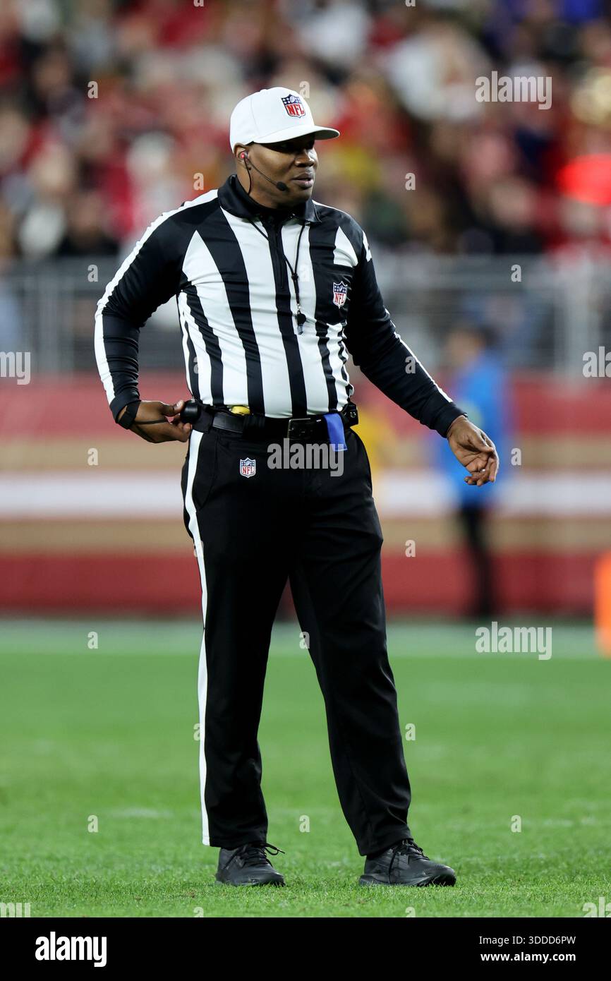 Referee Alex Moore (49) gestures during an NFL football game between ...
