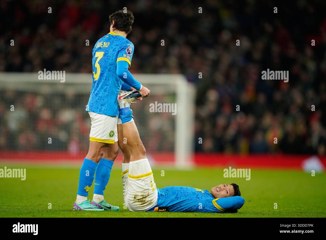 Wolverhampton Wanderers' Hugo Bueno helps Wolverhampton Wanderers ...