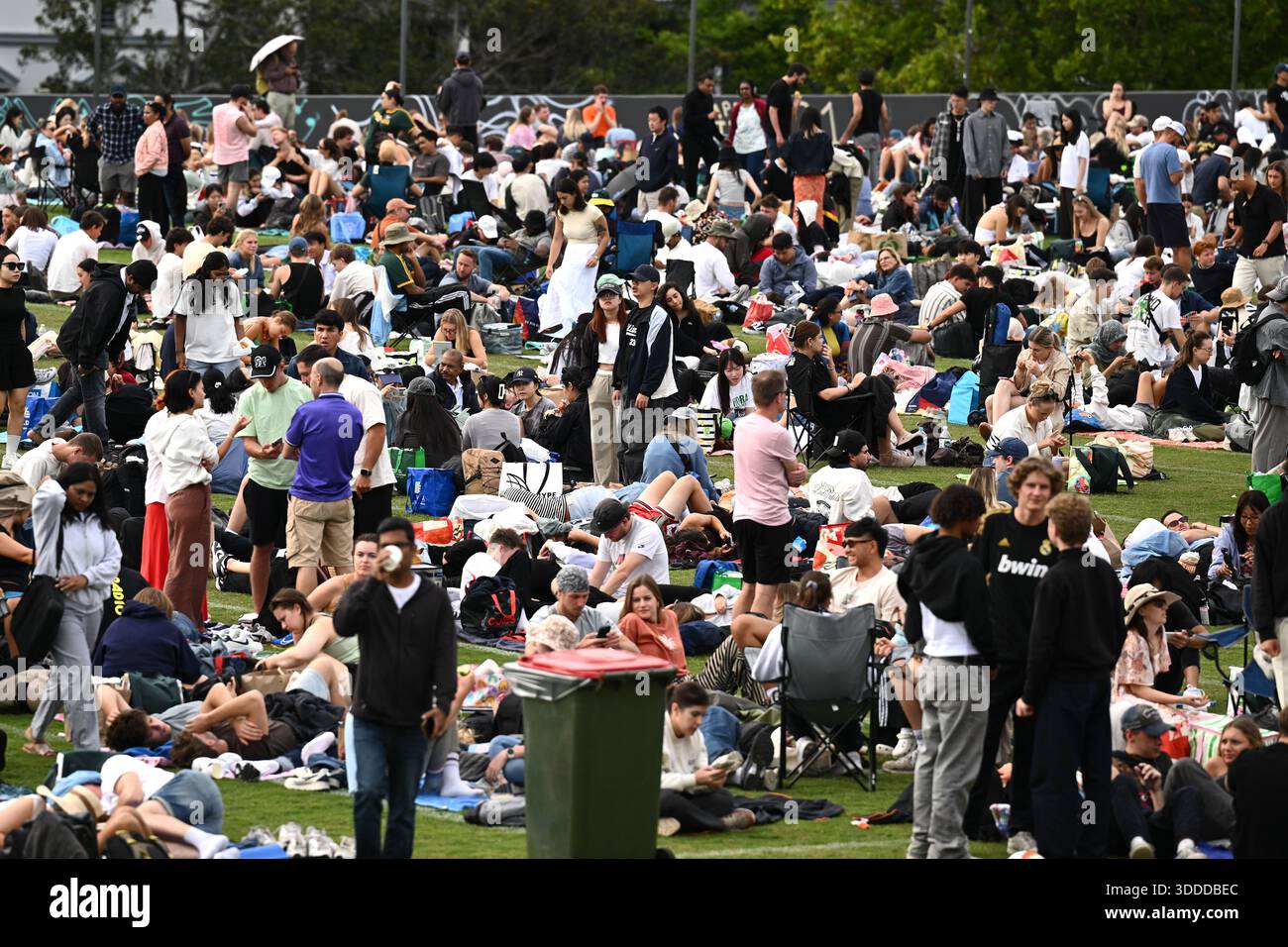 Spectators wait in long queues at the Domain to gain access to vantage ...