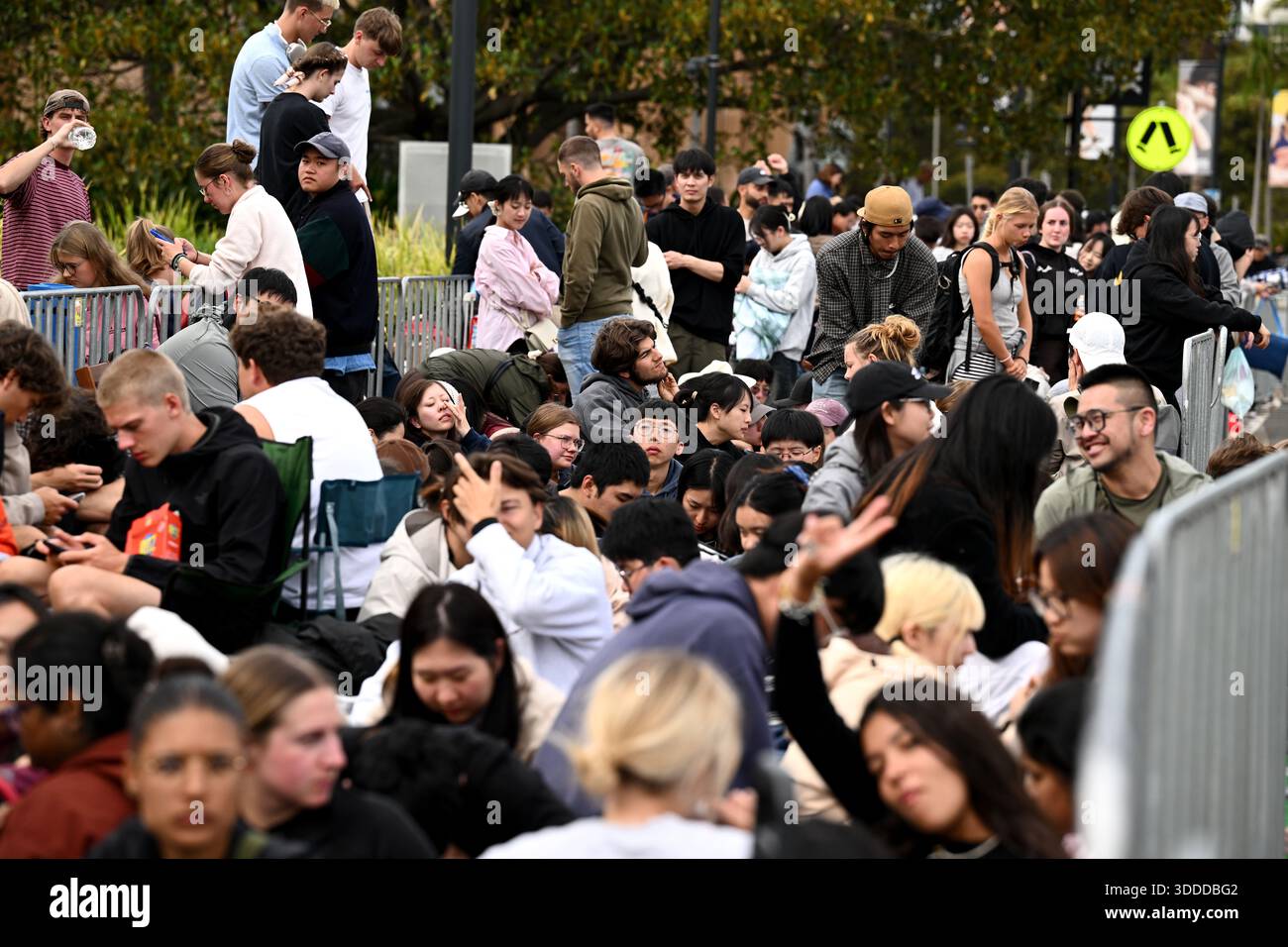 Spectators wait in long queues to gain access to vantage points during ...