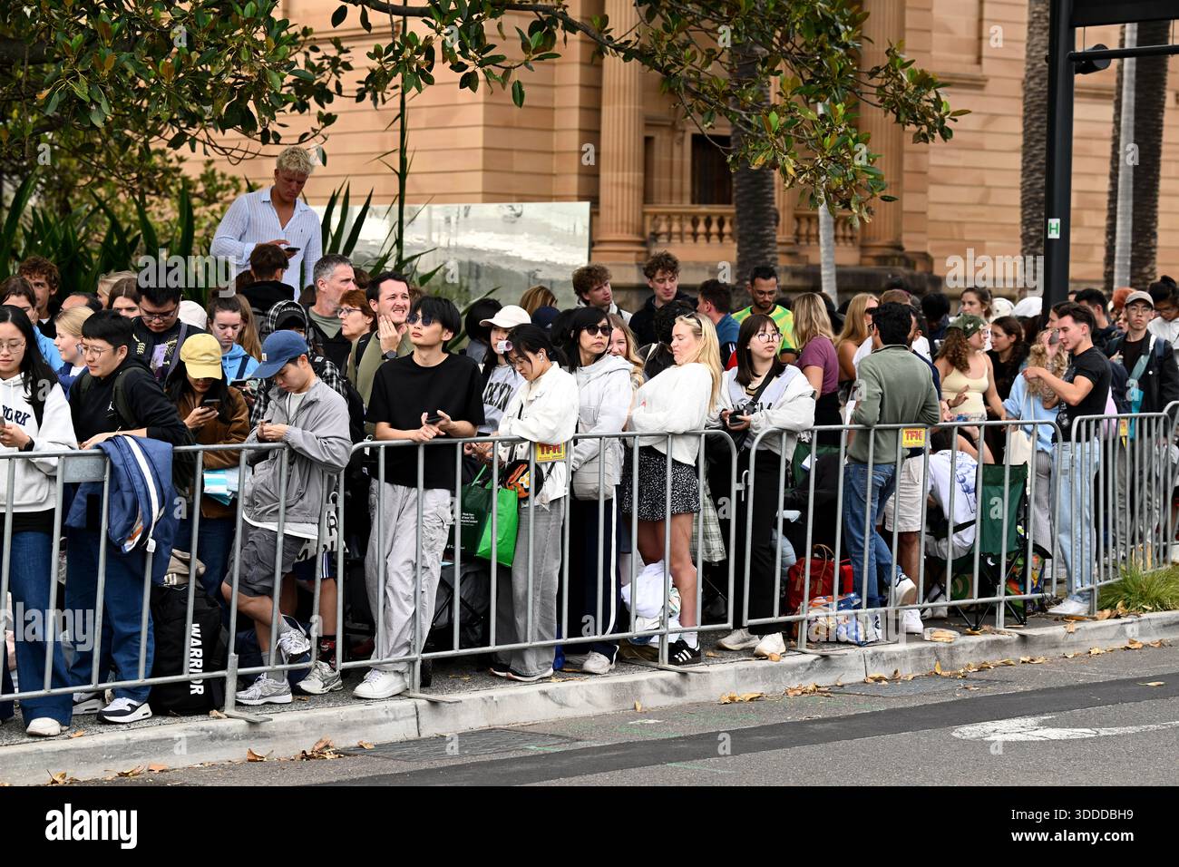 Spectators wait in long queues to gain access to vantage points during ...