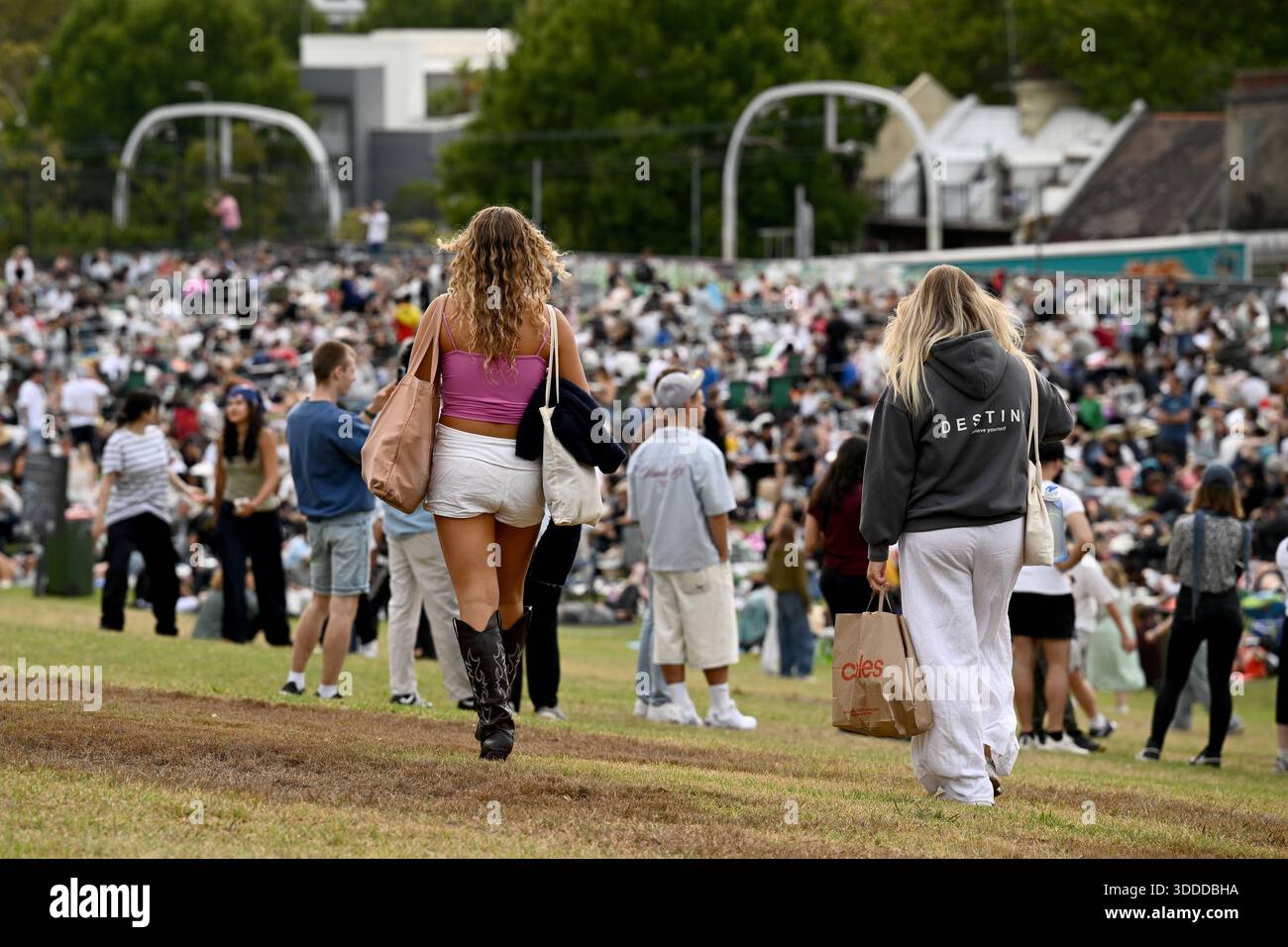 Spectators wait in long queues at the Domain to gain access to vantage ...