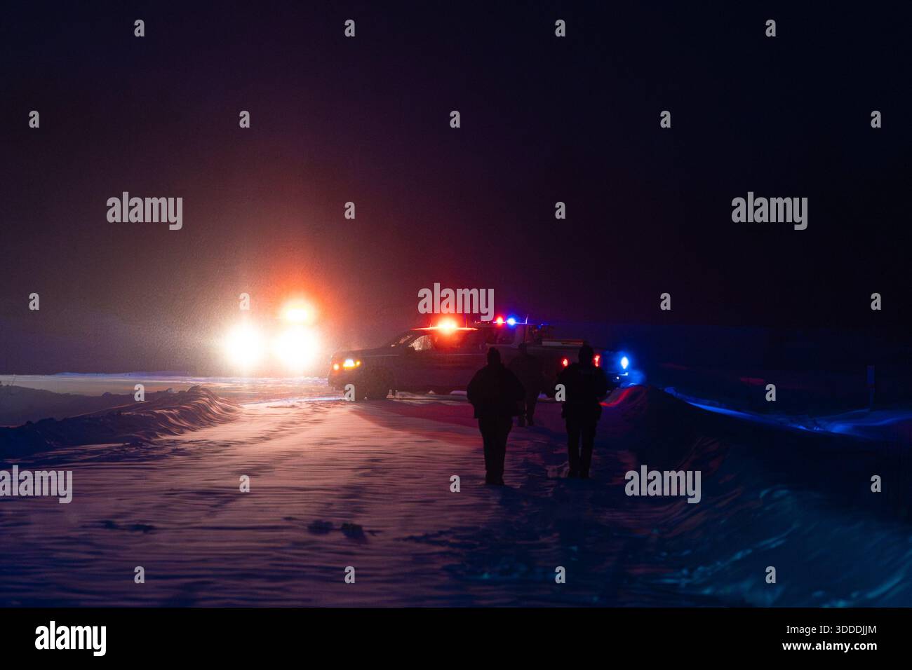 RCMP members patrol a road on at Big Island Lake Cree Nation, 392 ...