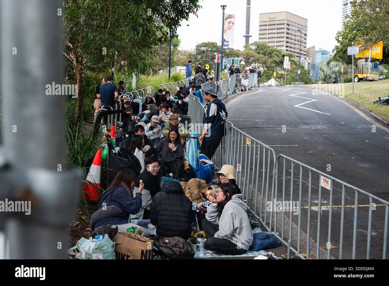 People are seen queuing at Mrs. Macquarie’s chair ahead of the News ...